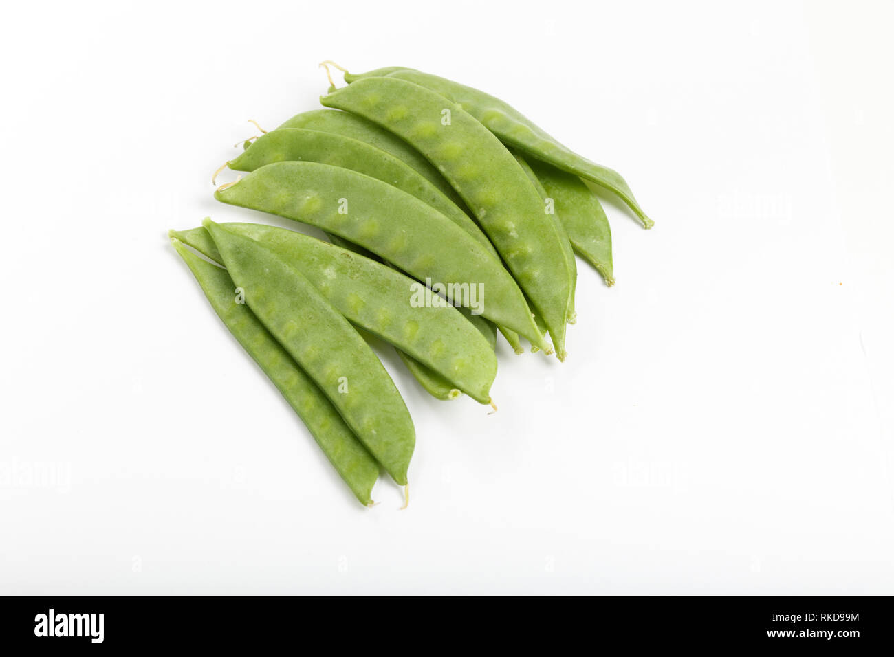 Fresh snow peas isolated on white background Stock Photo - Alamy