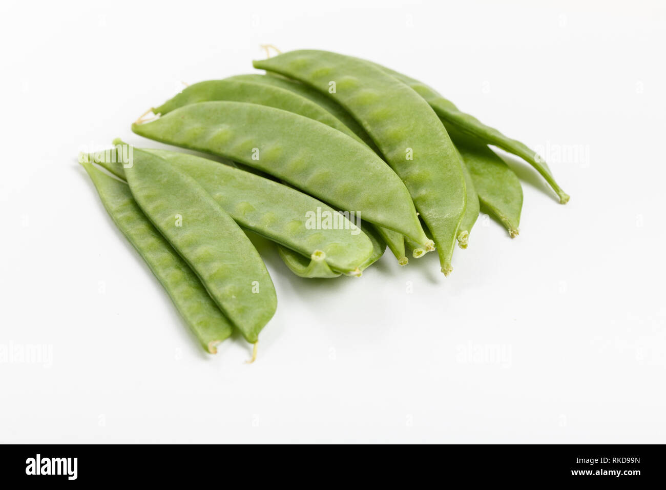 Fresh snow peas isolated on white background Stock Photo - Alamy