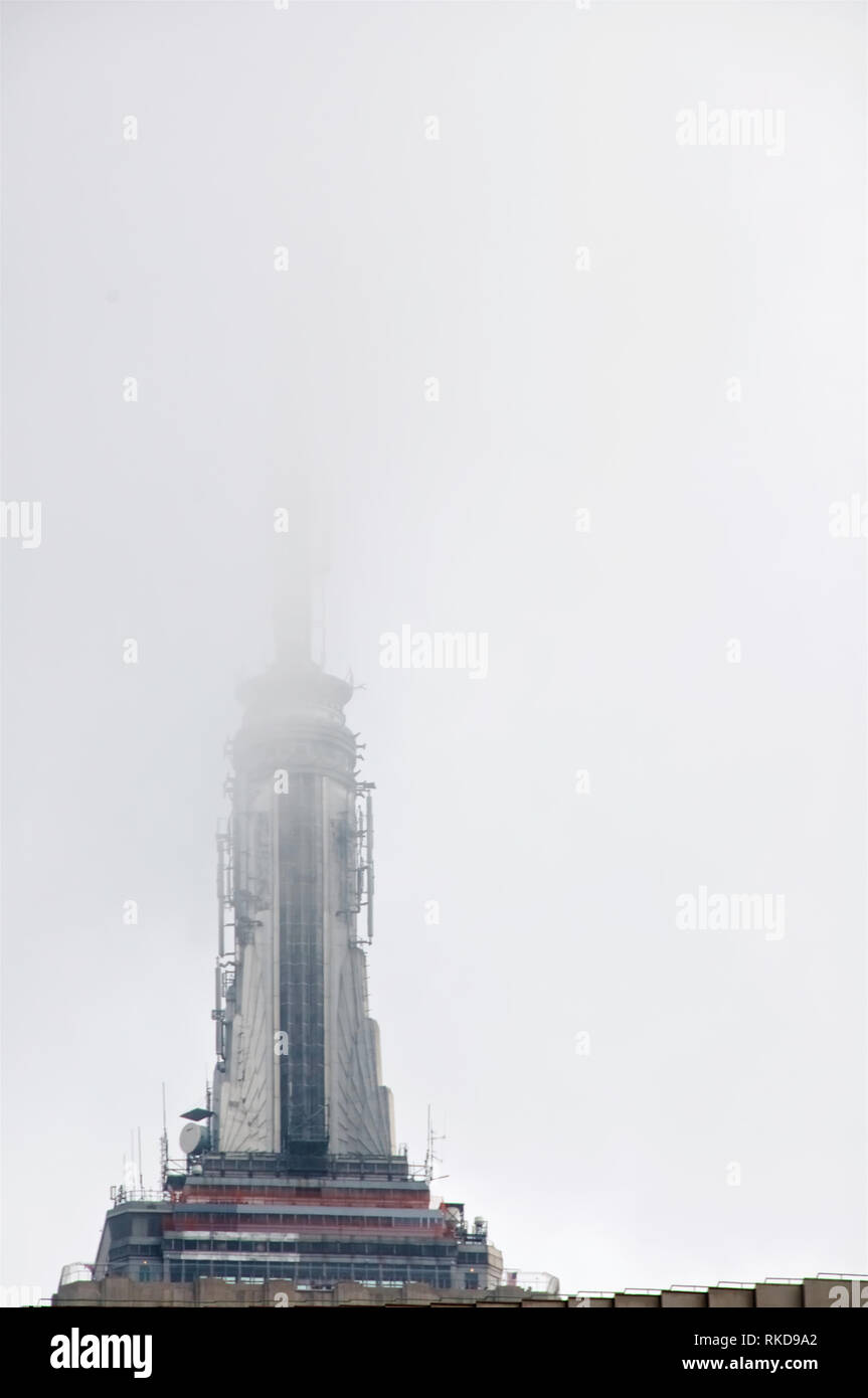 A cloud and mist obscured and covered tip of the iconic and symbolic ...