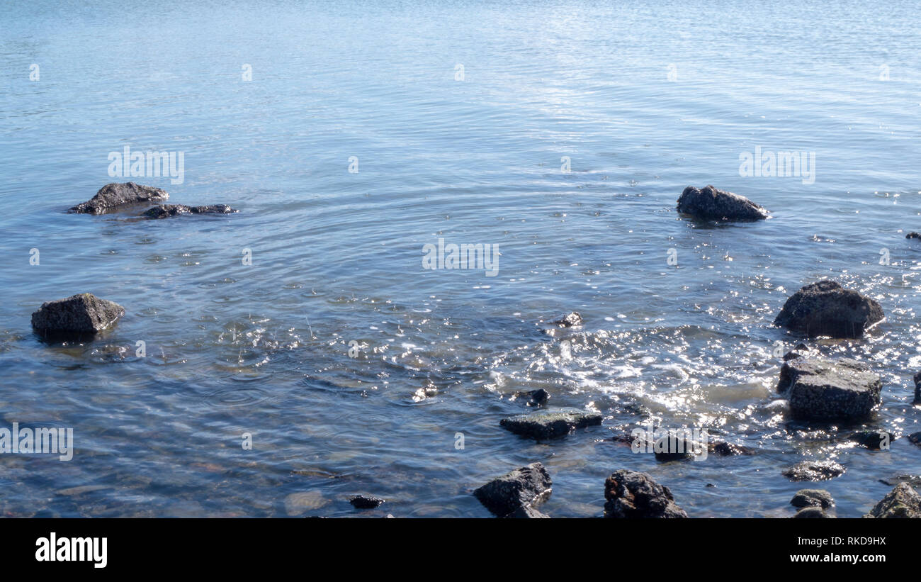 Throwing rocks in water hi-res stock photography and images - Alamy