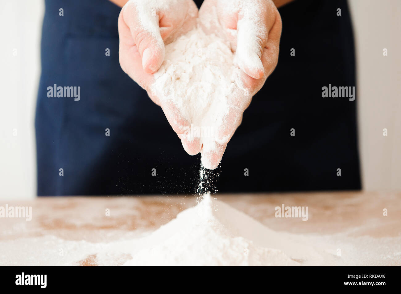 Chef preparing dough - cooking process, work with flour Stock Photo - Alamy