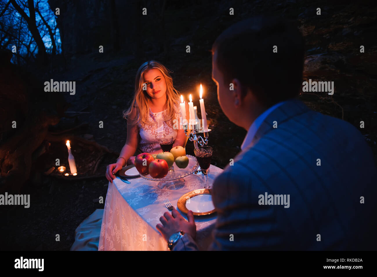 Romantic couple together over candlelight during romantic dinner Stock ...