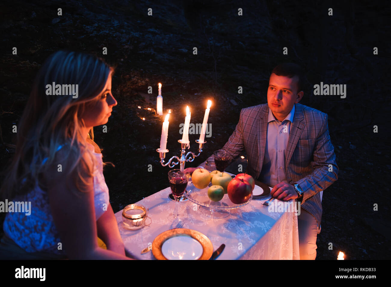 Romantic couple together over candlelight during romantic dinner Stock ...