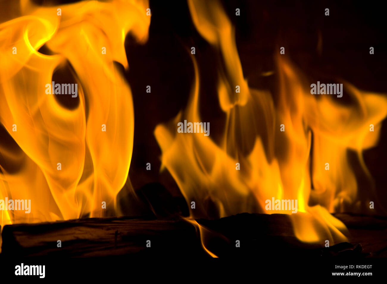 A close up view of flames rising in the dark sky from a camp fire Stock ...