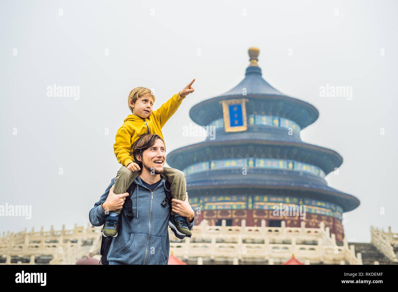Dad and son travelers in the Temple of Heaven in Beijing. One of the ...