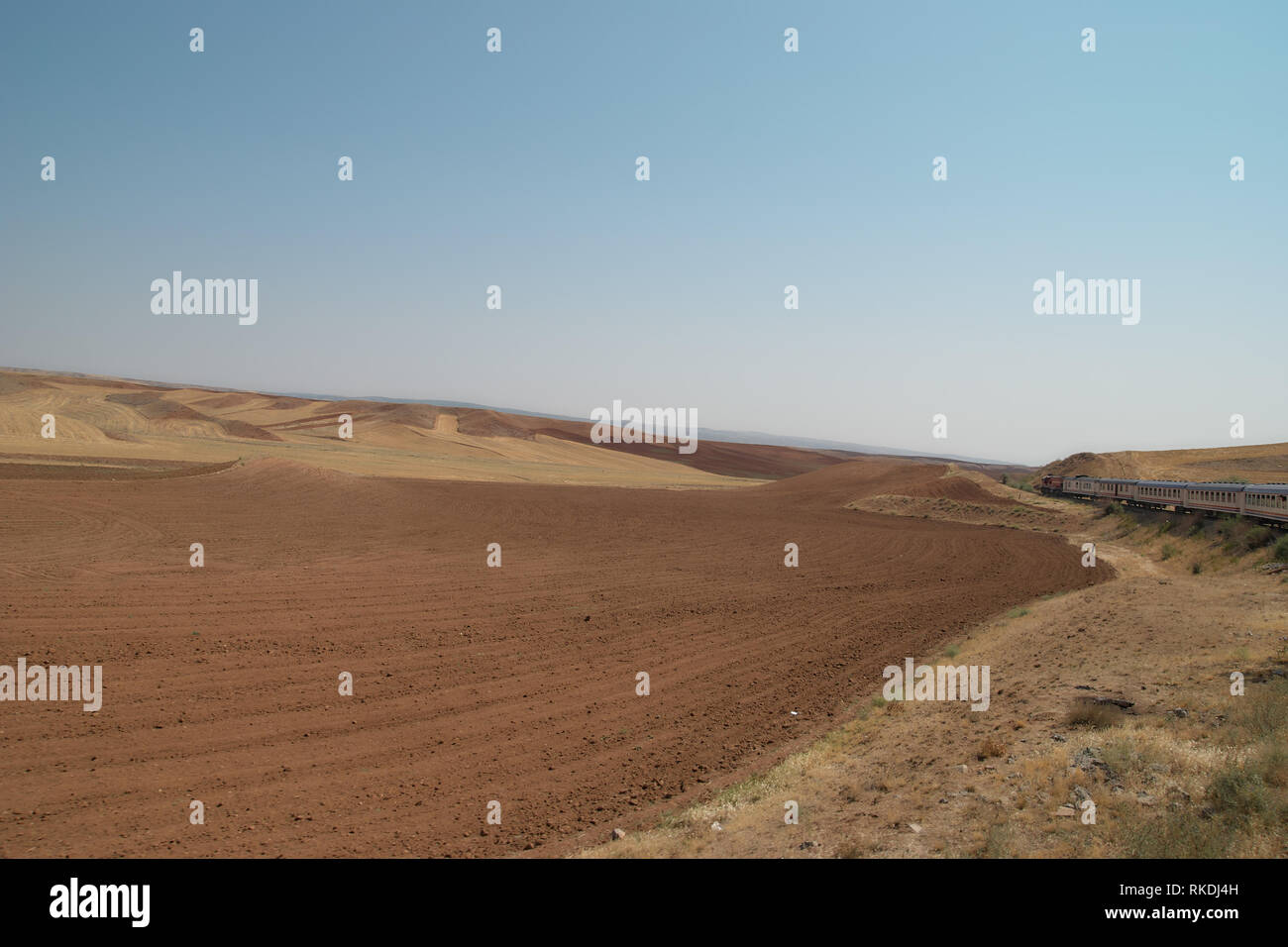 Desert landscape of Turkey with train moving from Ankara to Kayseri ...