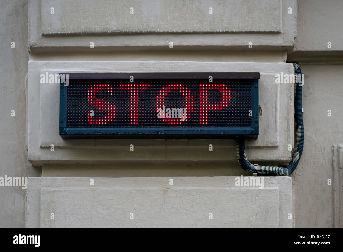 digital stop sign on black background Stock Photo - Alamy