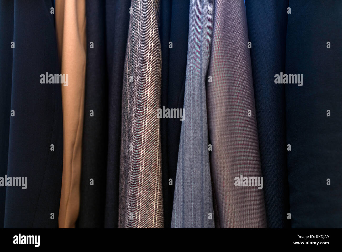 Different clothing textures in the closet, business suits Stock Photo ...