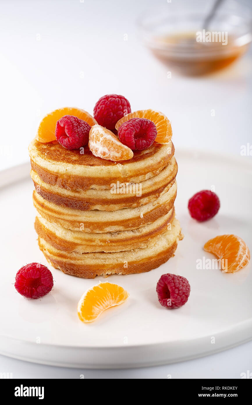 American Sweet homemade stack of pancakes or fritters with raspberry ...