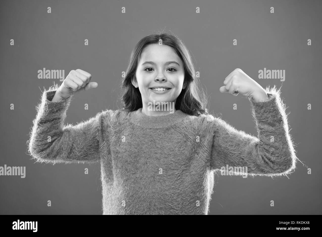 Child cute girl show biceps gesture of power and strength. Feel so ...