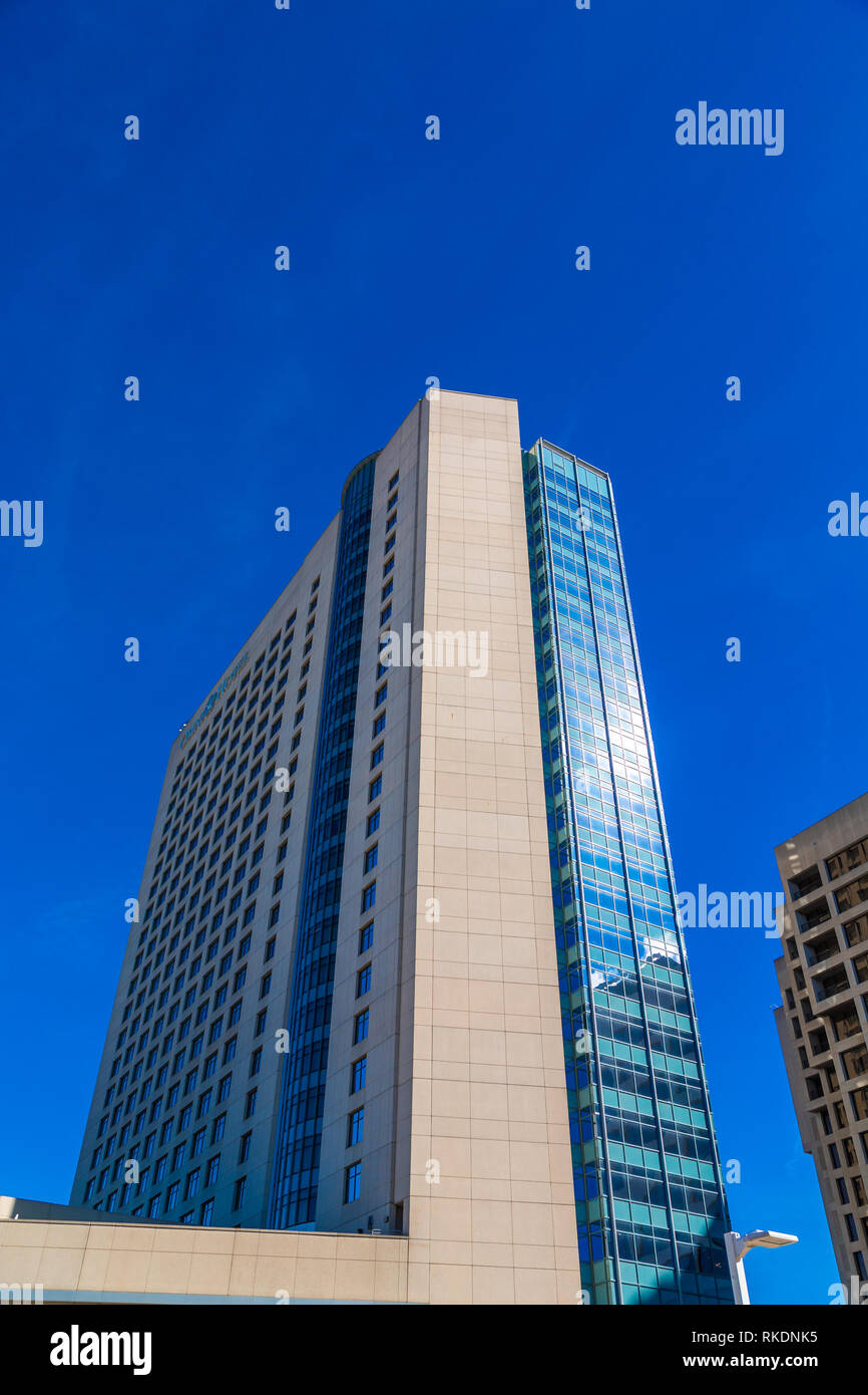 A modern high rise condo towers of stone and blue glass Stock Photo - Alamy