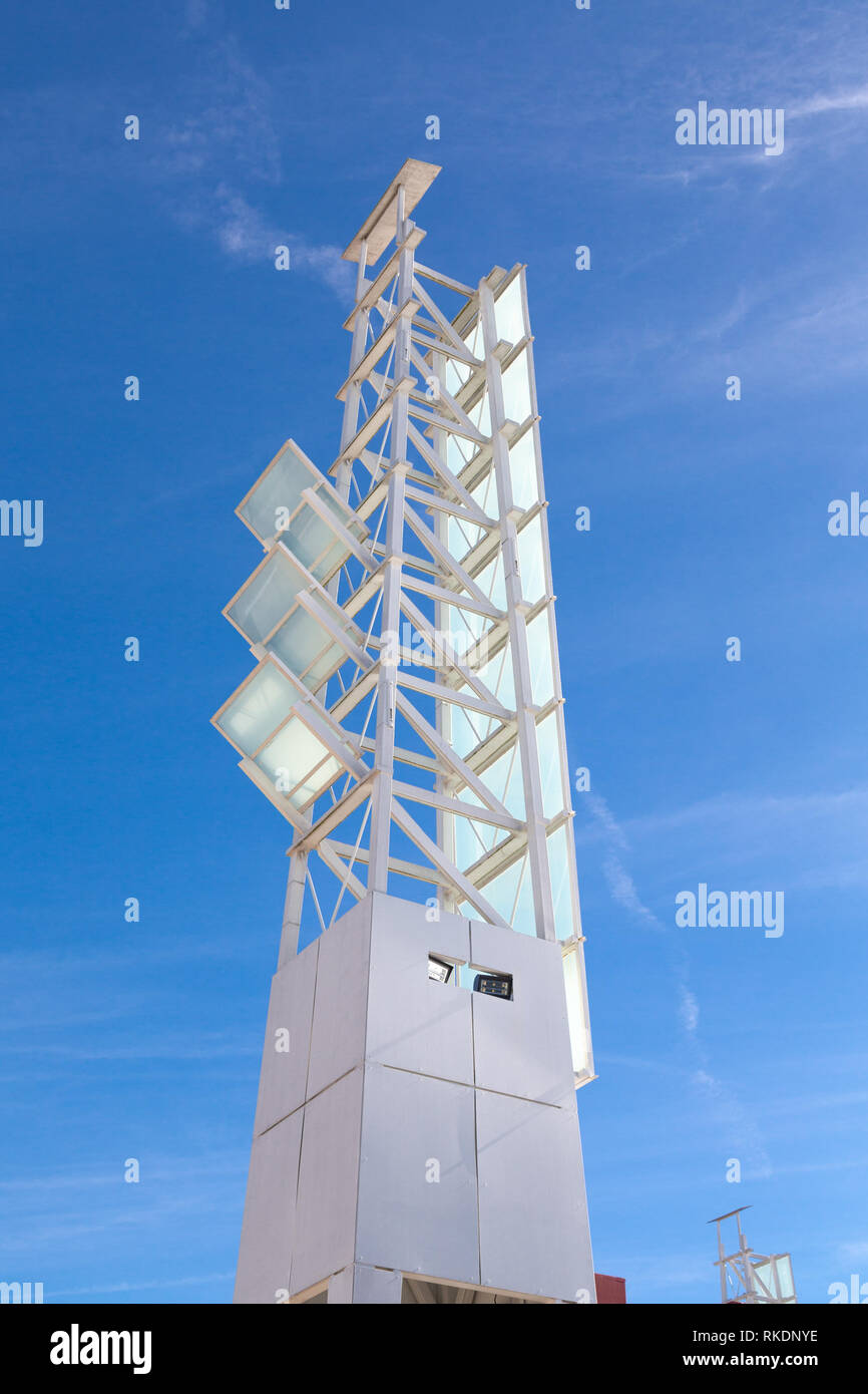 A white tower in a park providing light from solar panels Stock Photo ...
