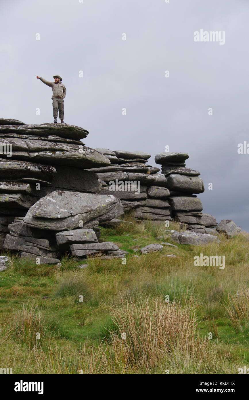 Outdoorsman Atop Littaford Tors, Cornubian Granite Tor on a Grey Day ...