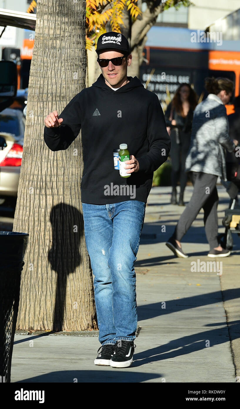 Max Greenfield goes on a coffee run wearing a baseball cap Featuring ...