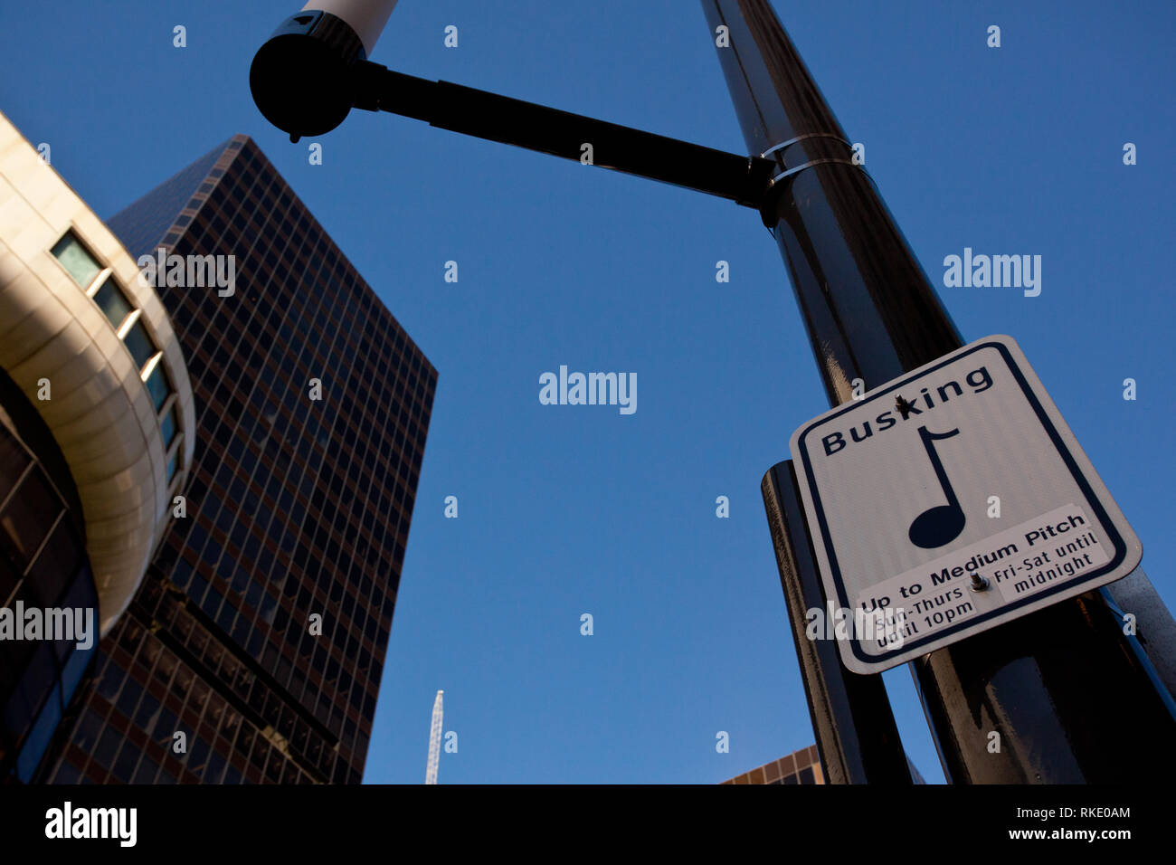 Medium Pitch Busking Sign featuring a musical note is mounted on a ...
