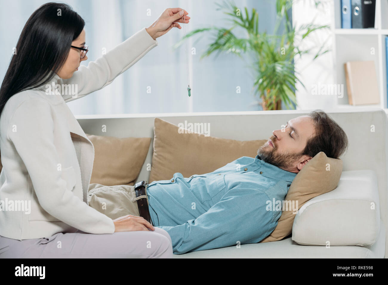 Hypnotist pendulum hi-res stock photography and images - Alamy