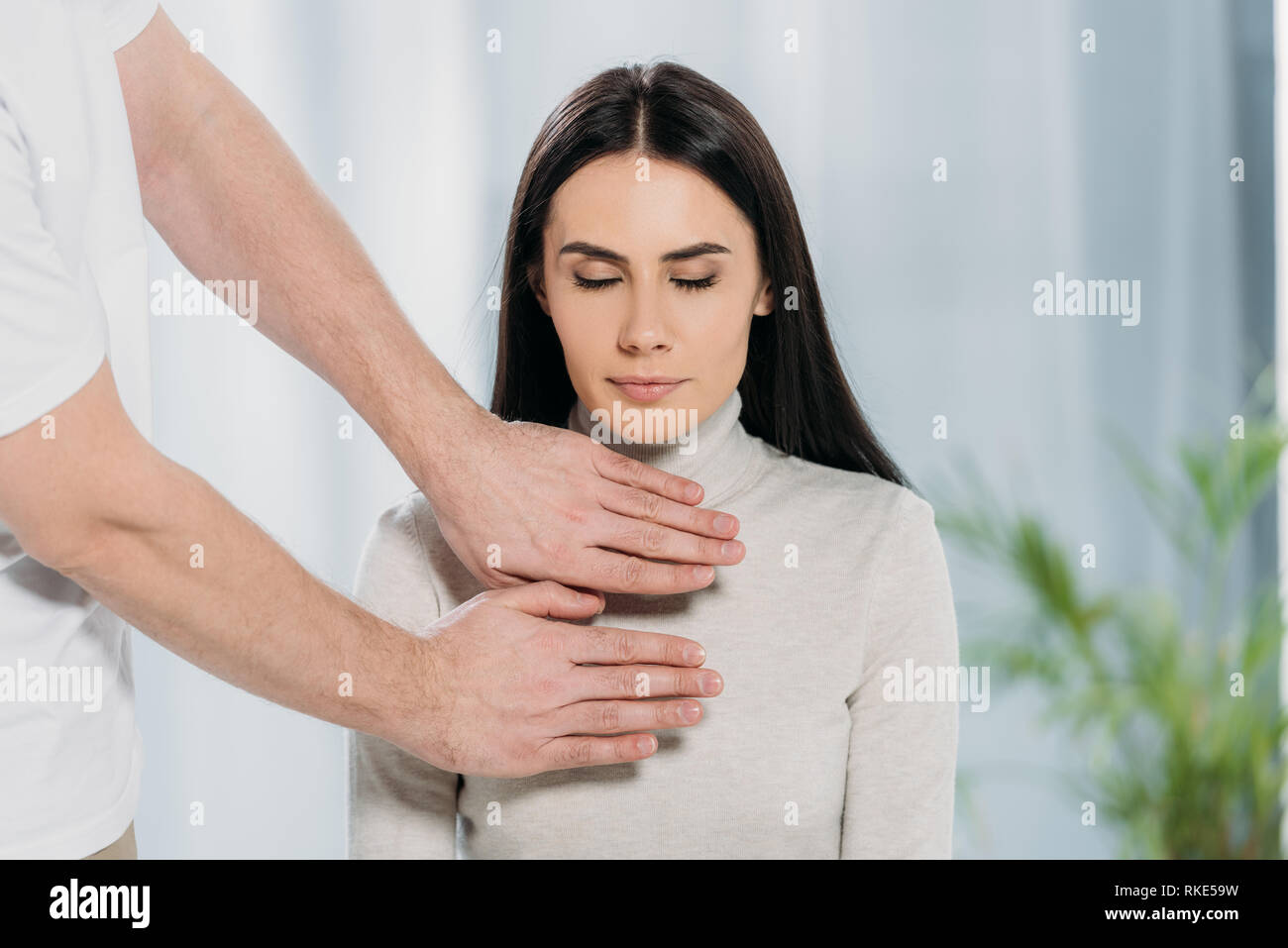 Woman sitting on chest hi-res stock photography and images - Alamy