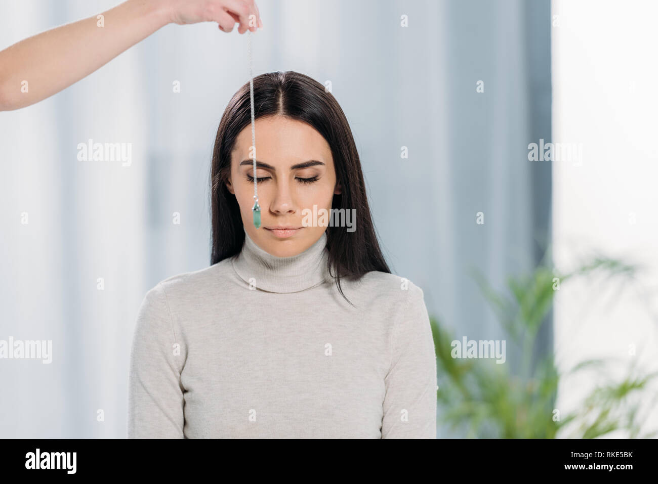 Hypnotizing hand hi-res stock photography and images - Alamy