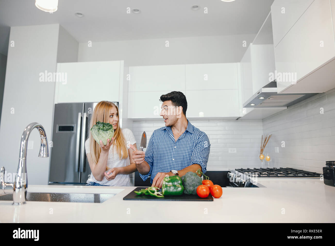 couple at home in a kitchen Stock Photo - Alamy