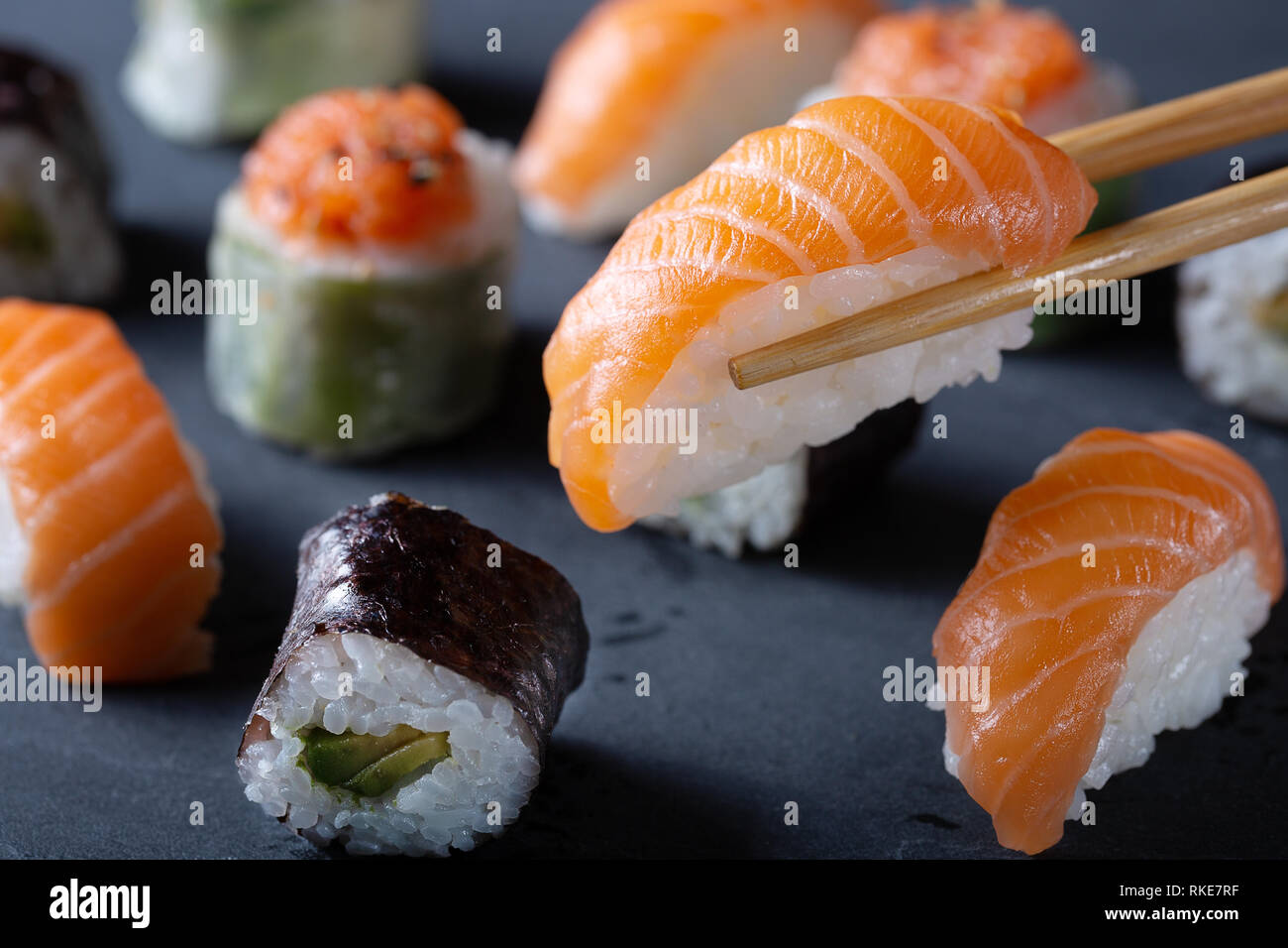 Fresh seafood sushi meal on darck background Stock Photo - Alamy