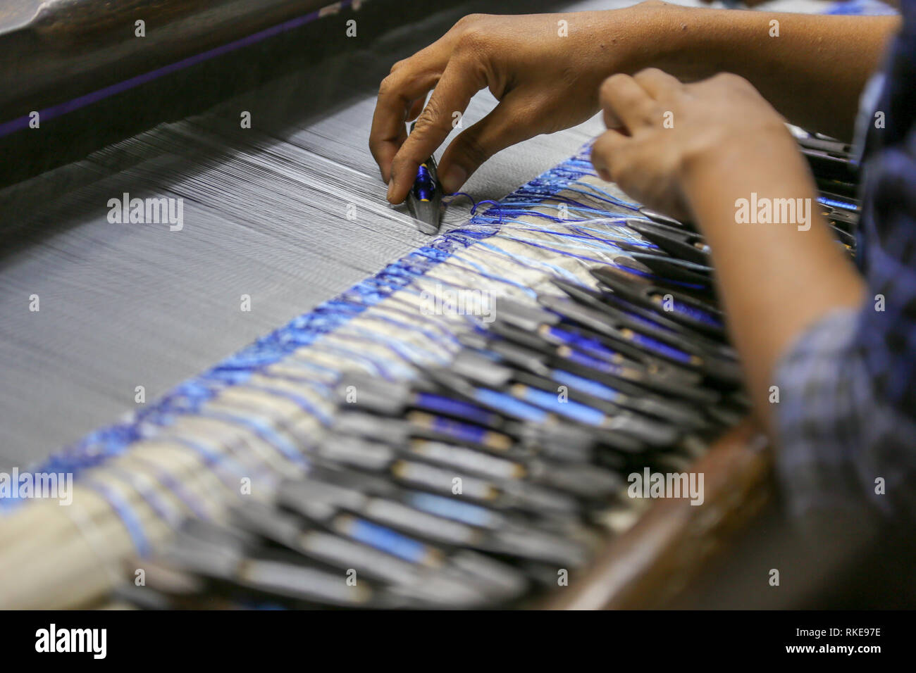 silk weaving and weaving hands, Myanmar Stock Photo - Alamy