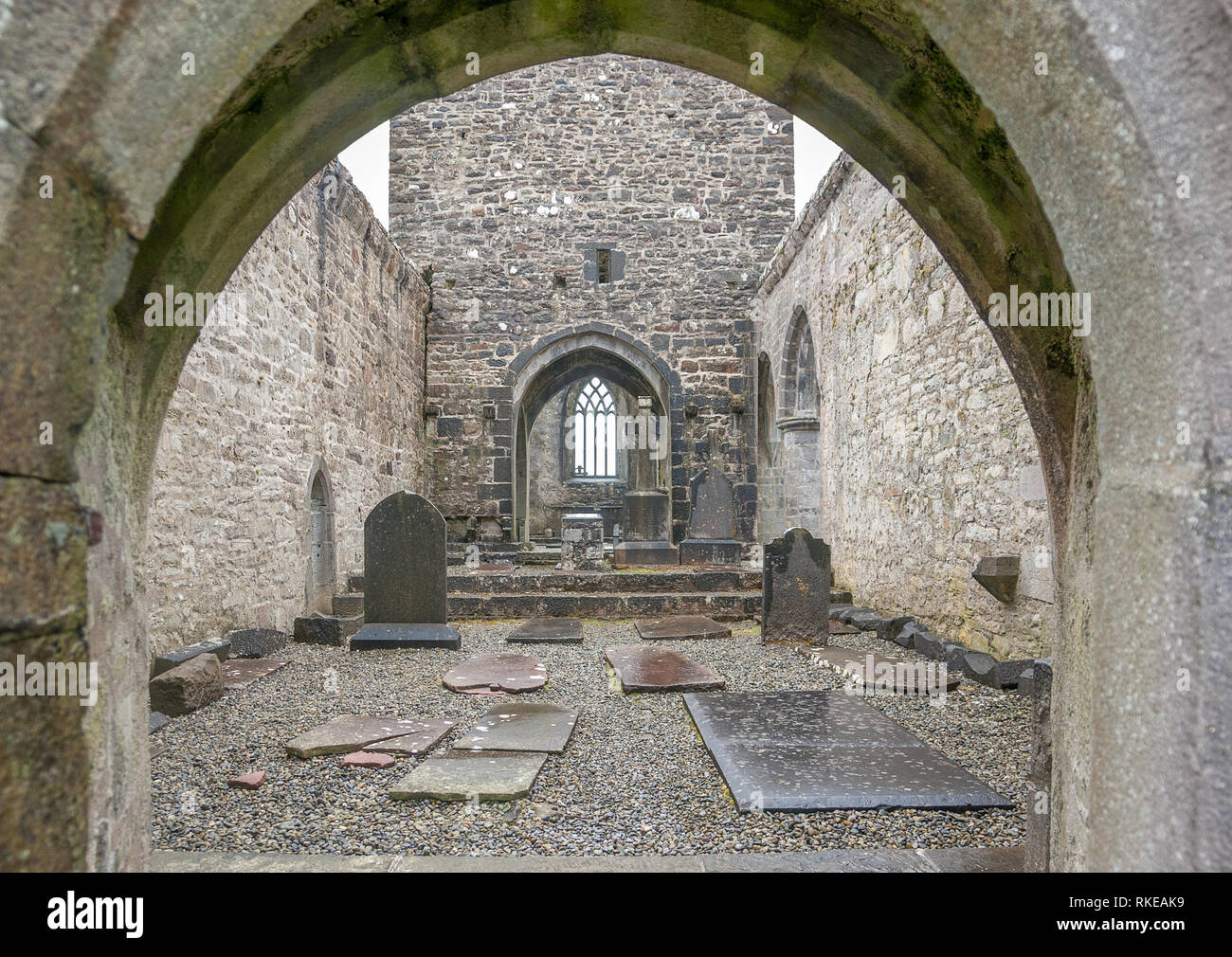 scenery inside a old church ruin with graveyard seen in Connemara, a ...