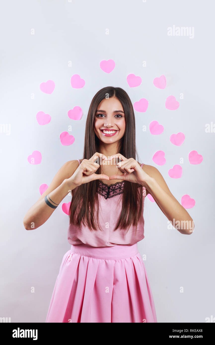 Indian girl making heart shape hi-res stock photography and images - Alamy