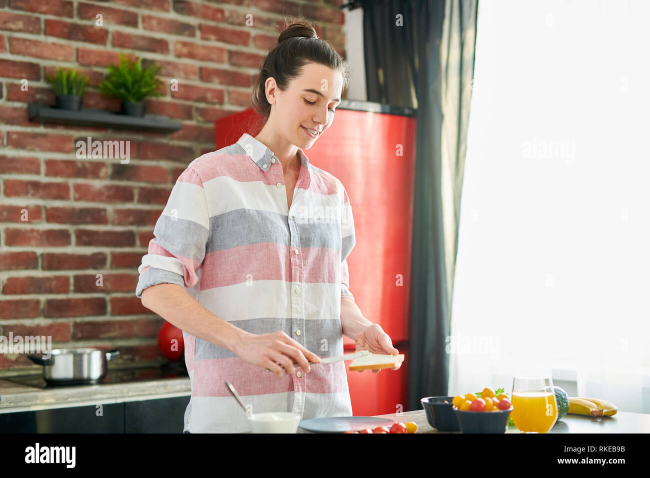 Woman modern kitchen breakfast hi-res stock photography and images - Alamy