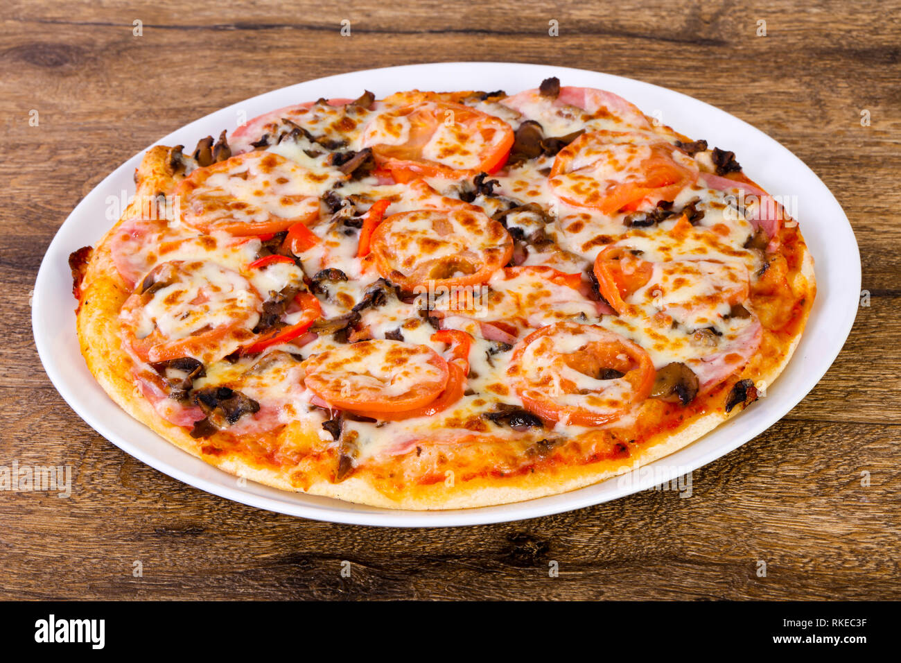 Pizza with ham and cheese Stock Photo - Alamy