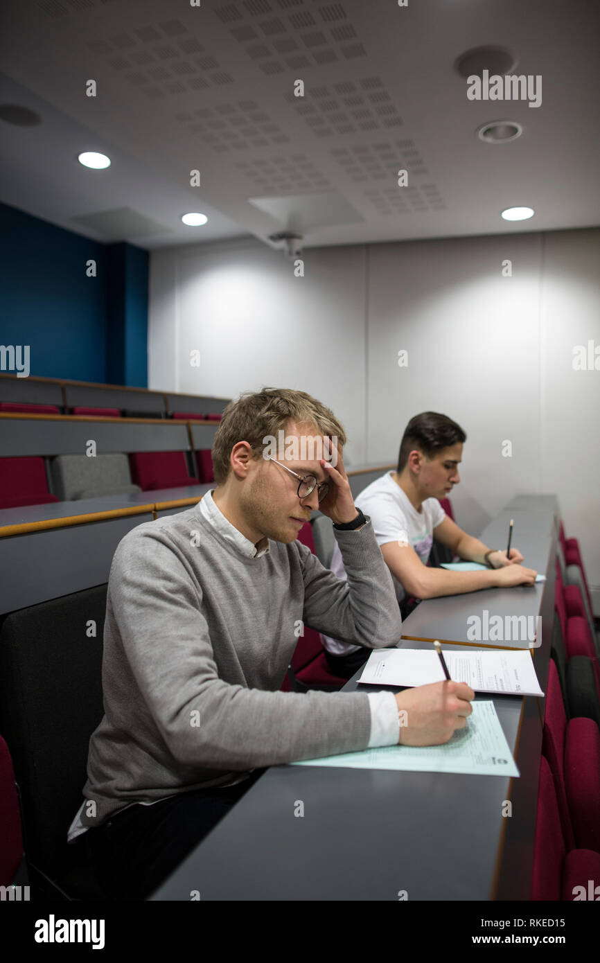 Man sitting supervised Mensa IQ test at University College London ...