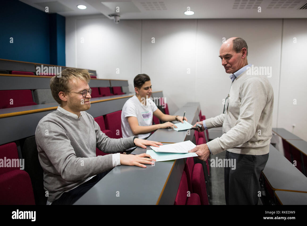 Man sitting supervised Mensa IQ test at University College London ...