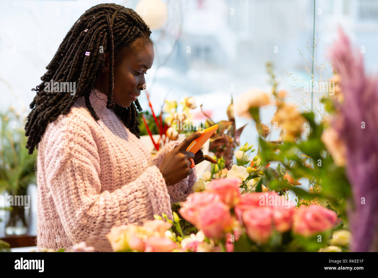 Profile photo of attentive girl that taking picture Stock Photo - Alamy