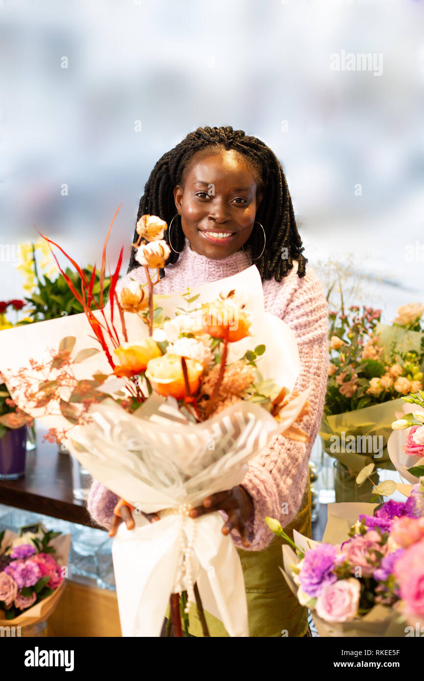 Positive delighted female person working with pleasure Stock Photo - Alamy