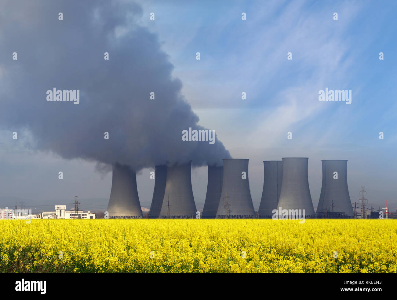 Nuclear power plant with yellow field and big blue clouds Stock Photo ...