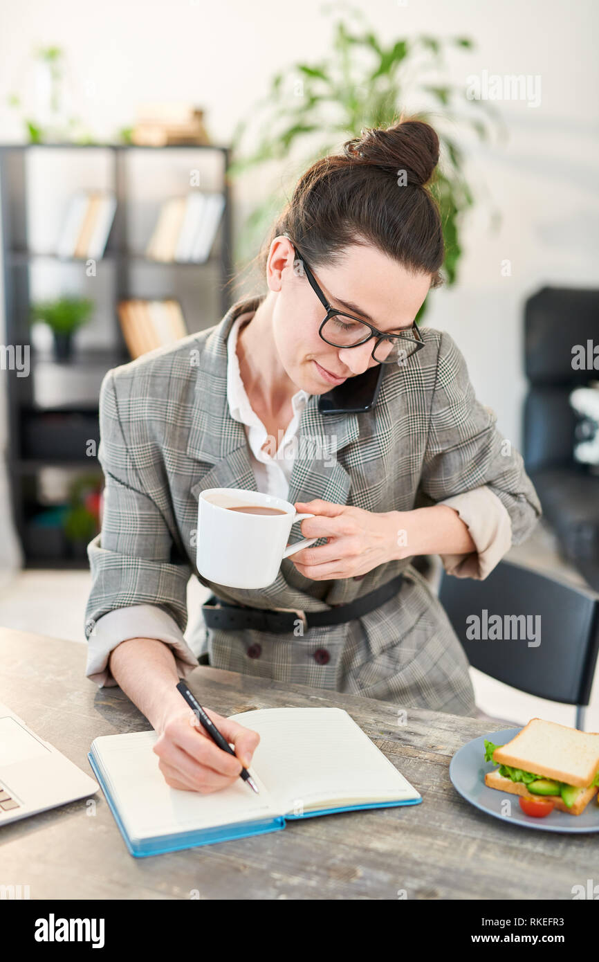 Overworked Young Woman Stock Photo - Alamy