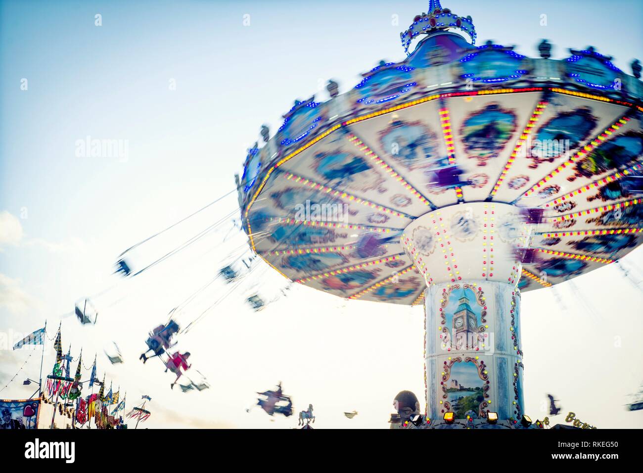 Close-up of Chair Swing ride with unrecognizable people in motion ...