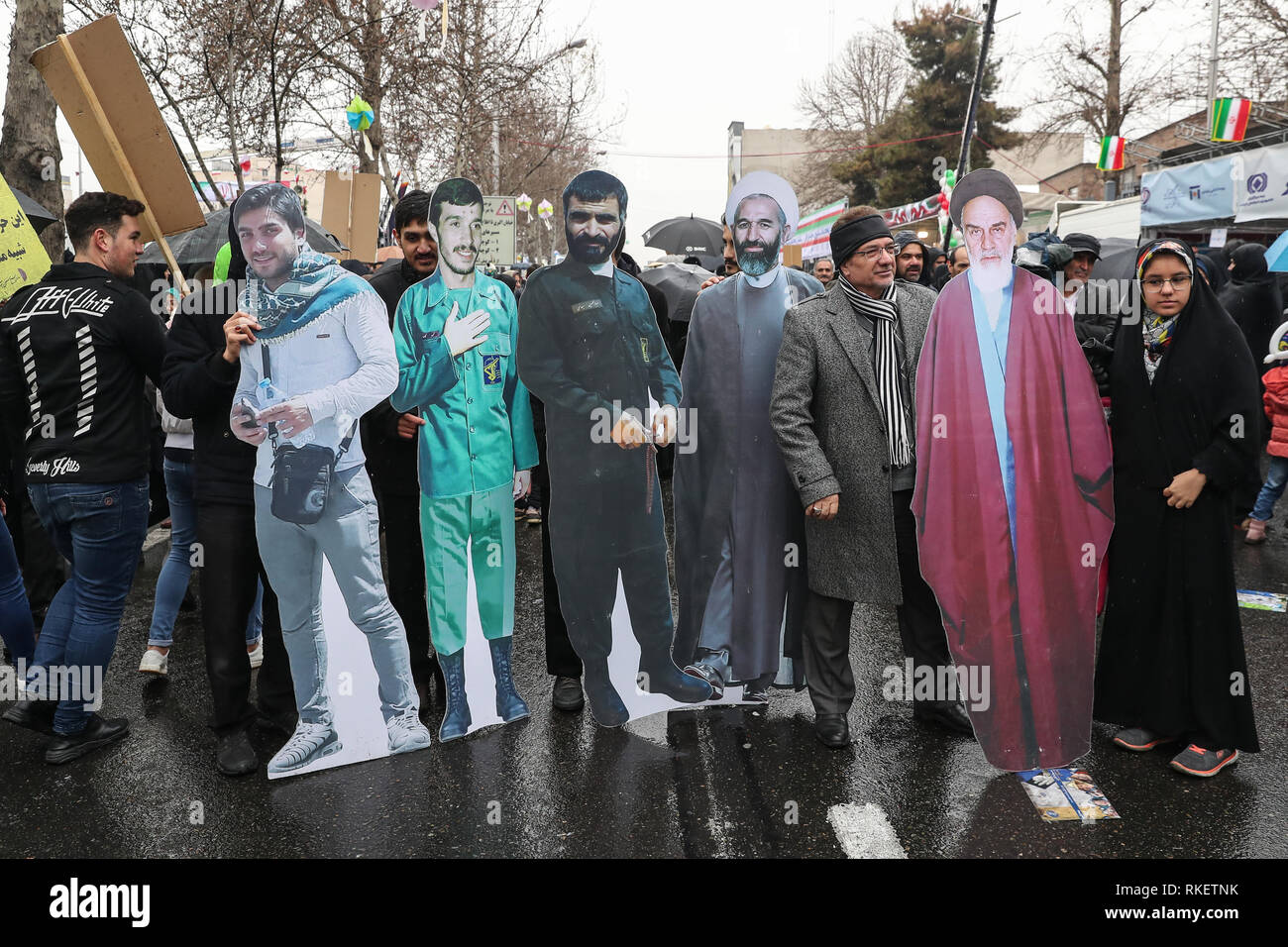 Tehran, Iran. 11th Feb, 2019. Iranians stand next to life-size ...
