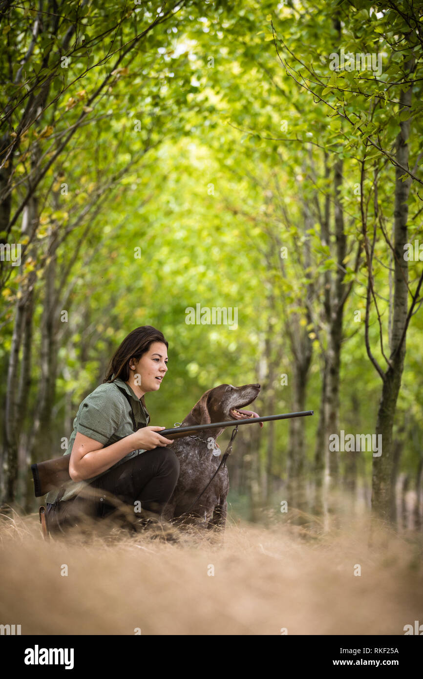 Autumn hunting season. Hunting. Outdoor sports. Woman hunter in the ...