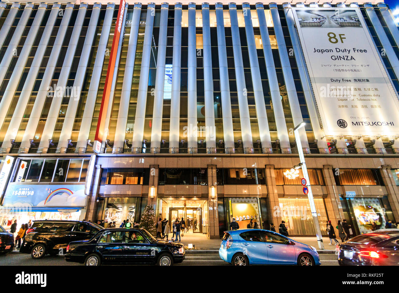 Tokyo Ginza at night. View across street of main entrance of Mitsukoshi ...