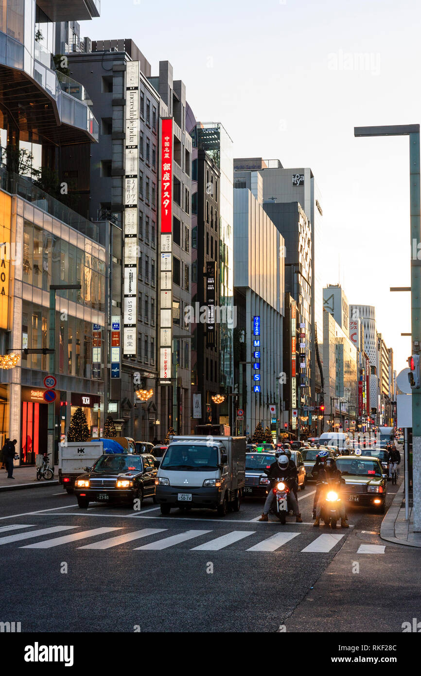 Tokyo, Ginza, golden hour. Traffic waiting at stop light in front of ...