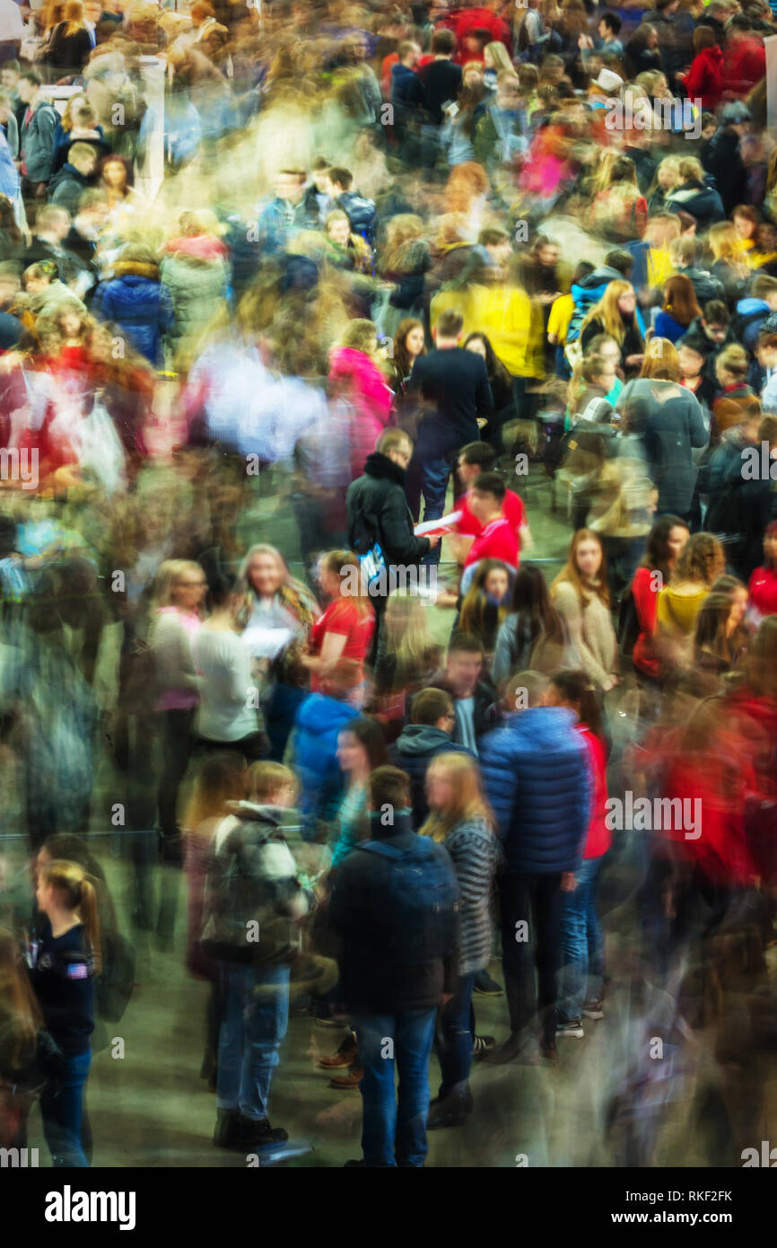 Long exposure photograph of people in an art fair, studies fair, motion ...