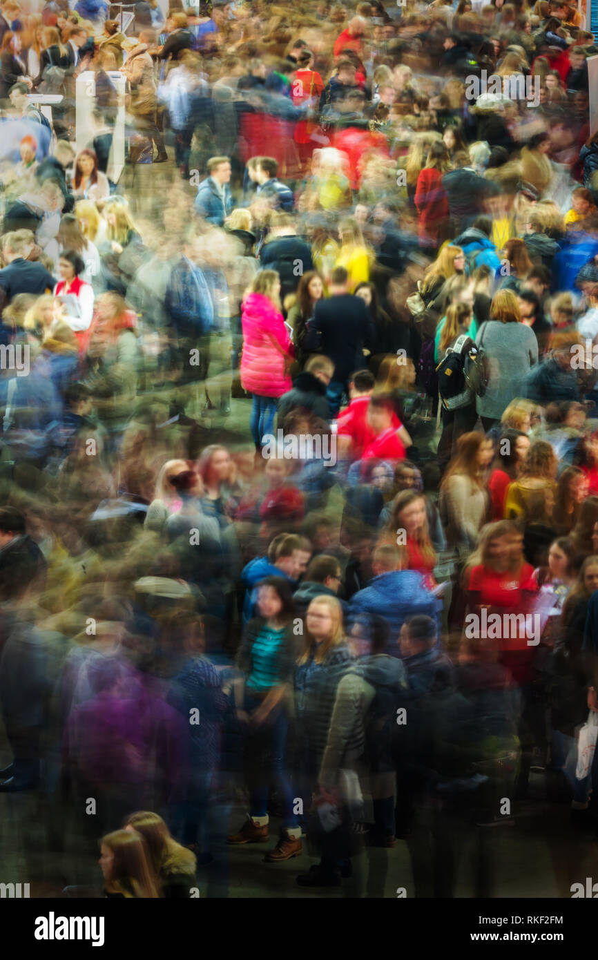 Long exposure photograph of people in an art fair, studies fair, motion ...