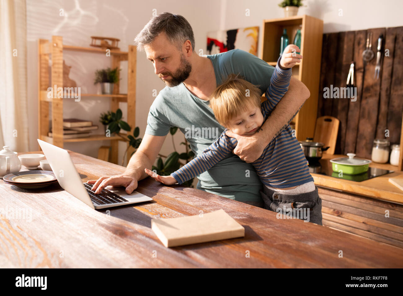 Man looking after child hi-res stock photography and images - Alamy