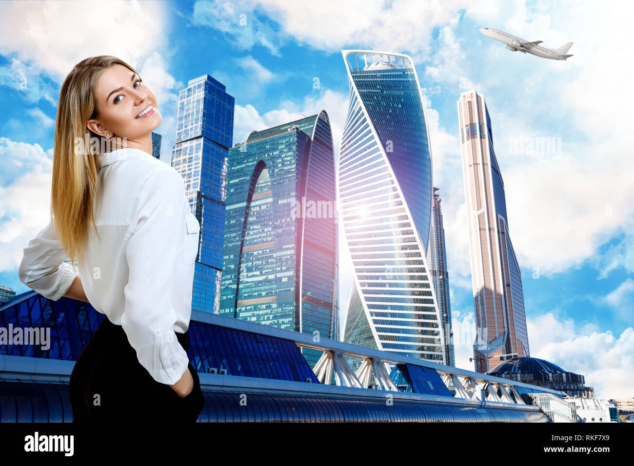 Confident young blonde businesswoman stands hi-res stock photography ...