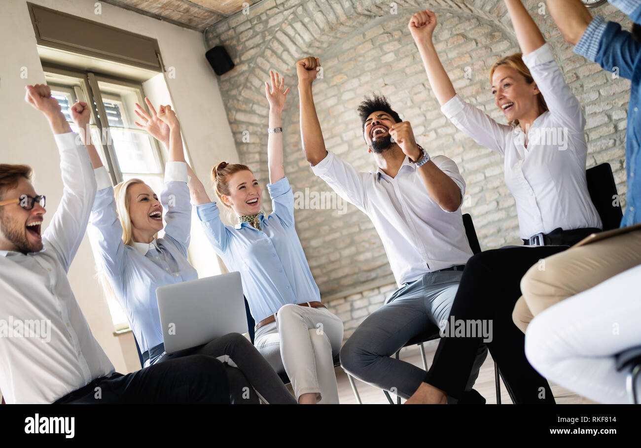 Business team celebrating a good job in the office Stock Photo - Alamy