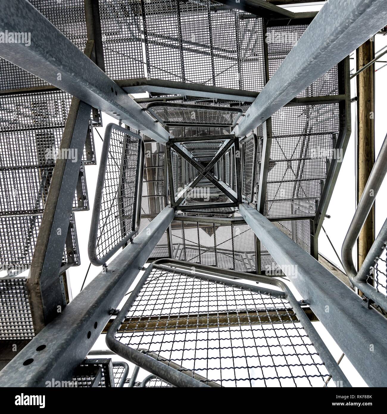 Square metal tower construction with staircase against white background ...