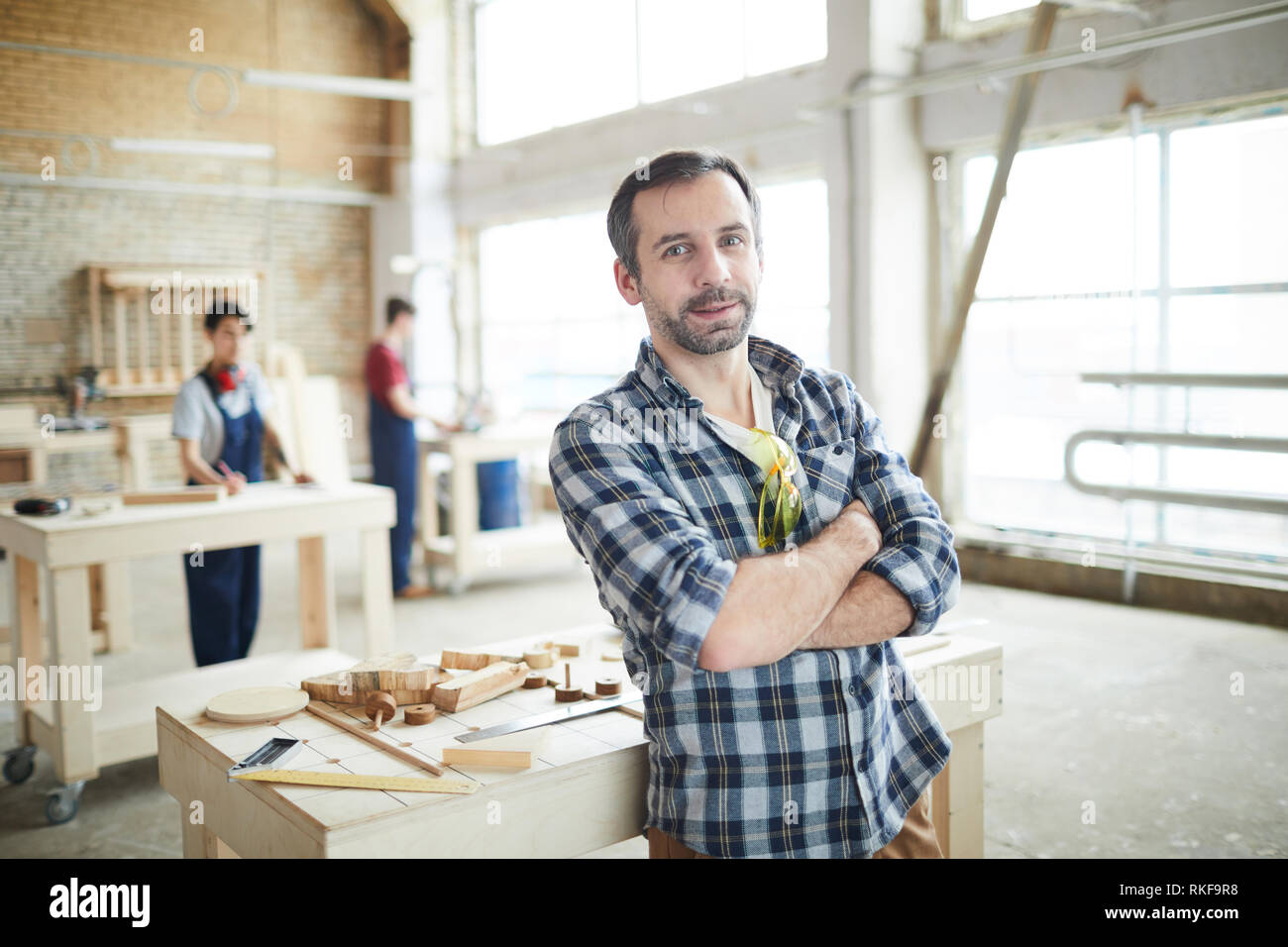 Confident workman in carpentry shop Stock Photo - Alamy