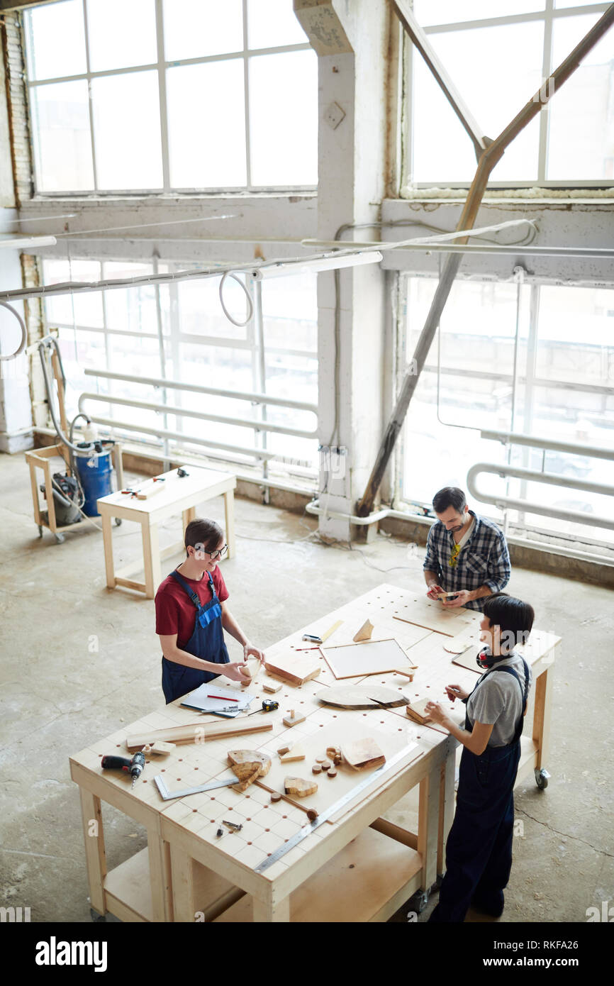 Group of carpenters at work Stock Photo - Alamy