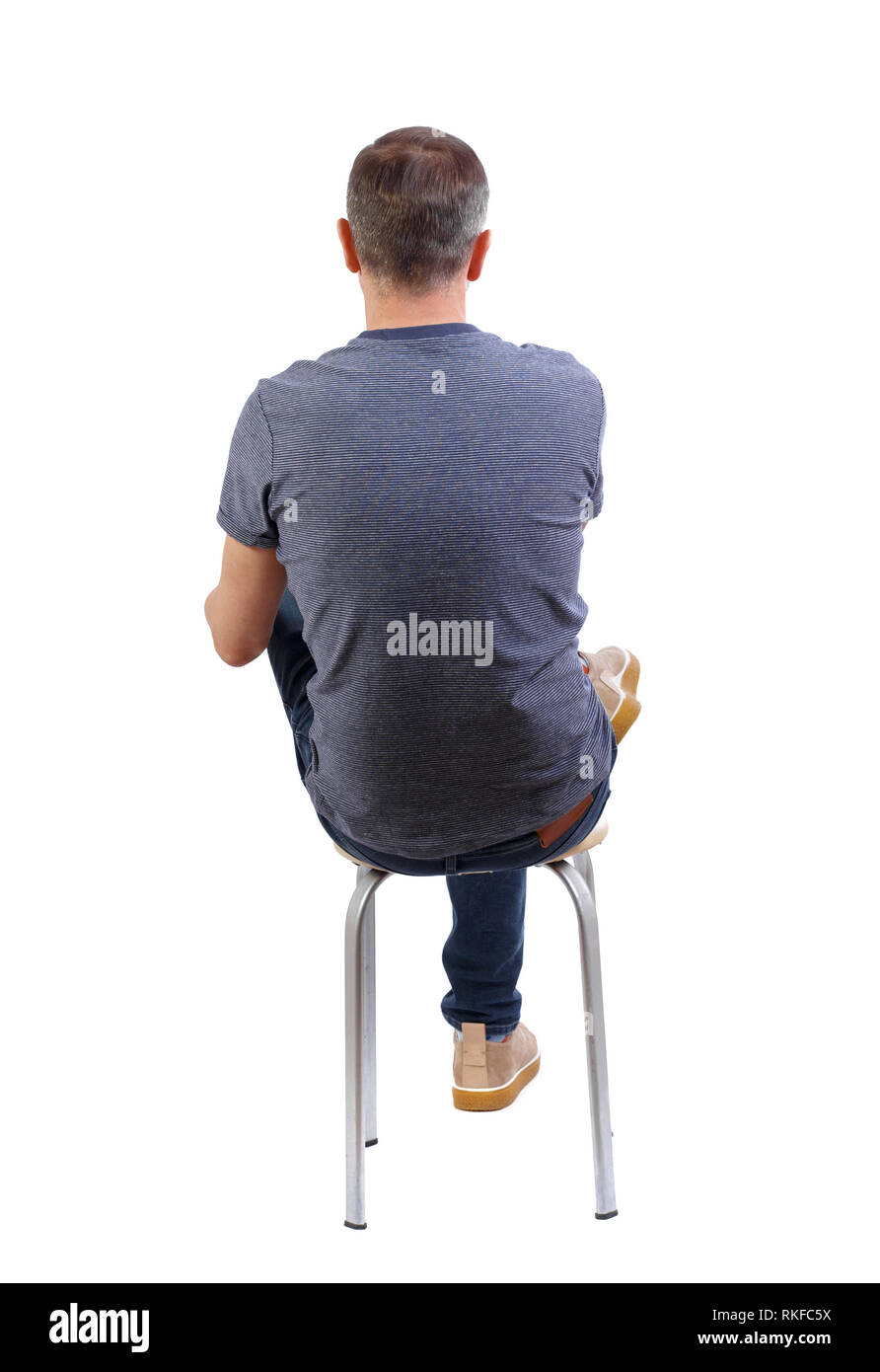 Back view of a man sitting on a chair. Rear view people collection ...
