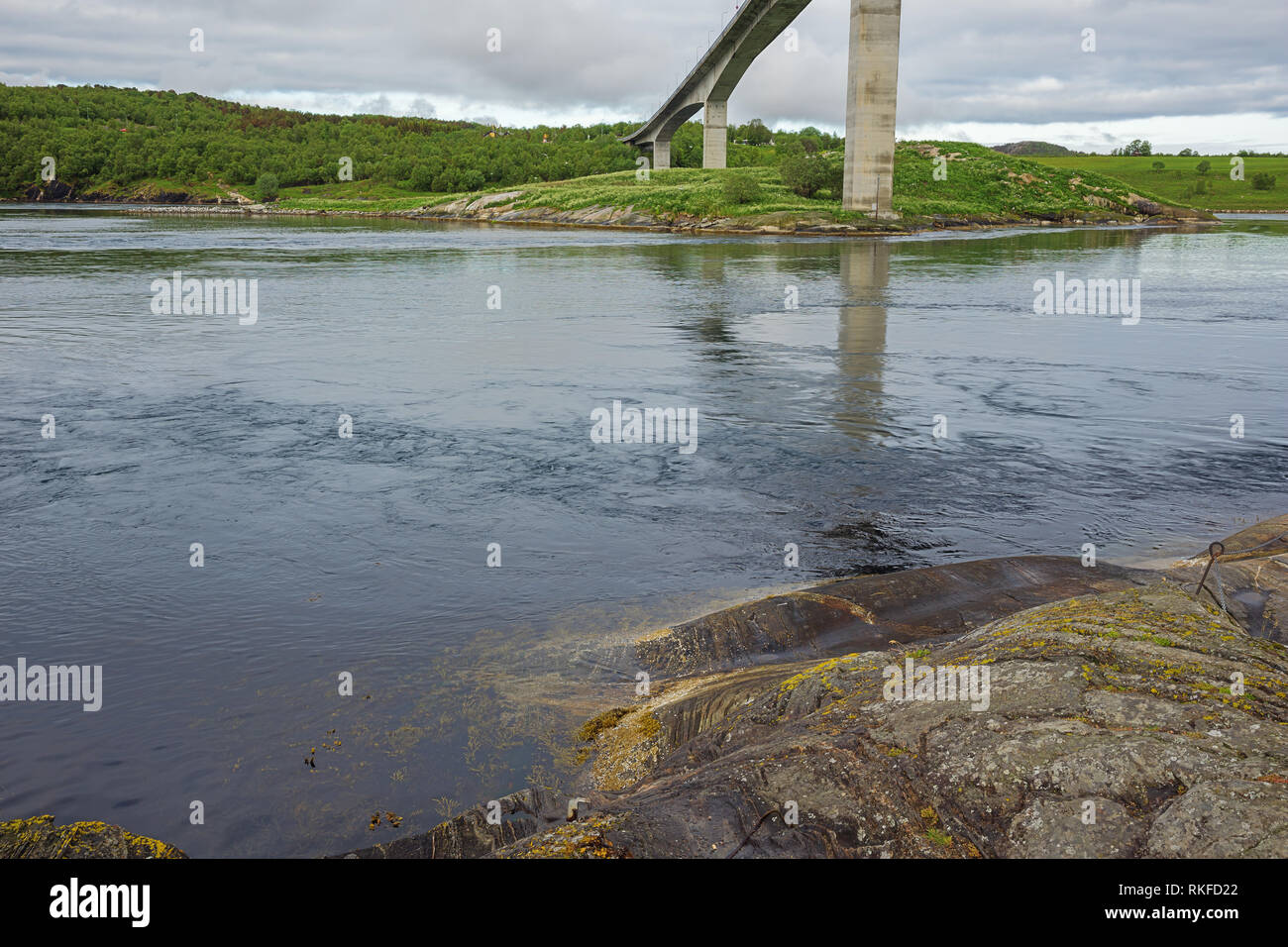 At the base of the Saltstraumen bridge with the tidal current gushing ...